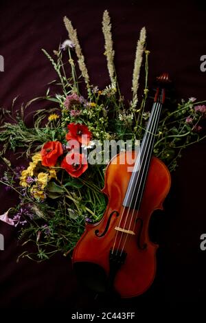 Still life with bouquet of wildflowers on a river bank Stock Photo - Alamy