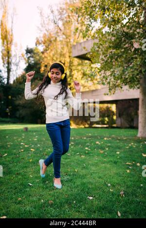 Girl dancing and listening music Stock Photo - Alamy