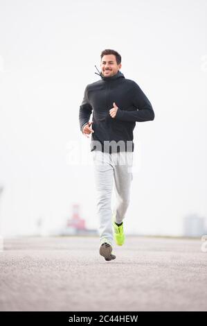 A man running in his lane Stock Photo - Alamy