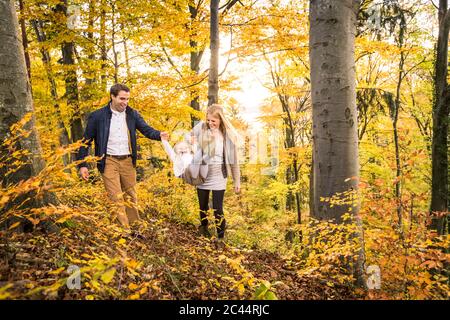 Girl swinging in forest during sunny day Stock Photo - Alamy