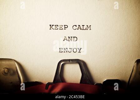 Keep calm and enjoy text written with a typewriter Stock Photo - Alamy