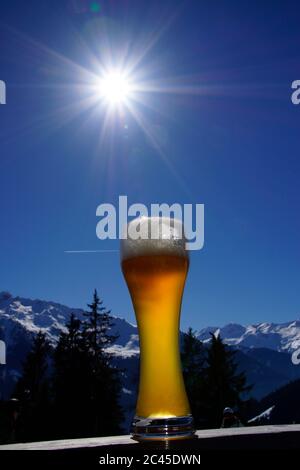 Wheat beer in alpine landscape, Kaprun, Austria Stock Photo - Alamy
