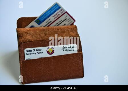 Qatar ID card & Medical Card in Brown Valet on white background Stock ...