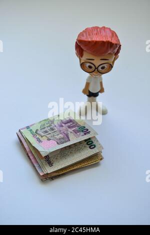 Cool boy Cartoon with Qatari currency on white background Stock Photo ...