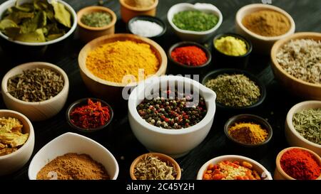Composition with bowls of different aromatic spices on light background ...