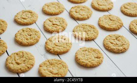 Healthy oatmeal cookies on white wood background, side view Stock Photo ...
