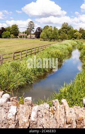 The River Coln passing the Cotswold village of Coln Rogers in the Coln ...