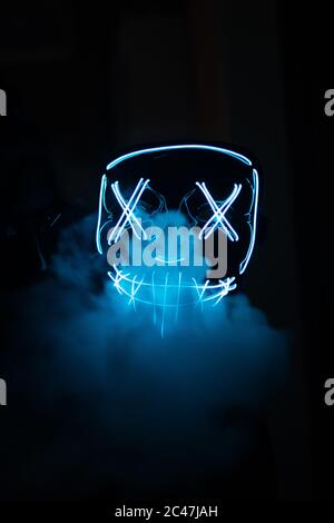 Man with blue led mask for partying Stock Photo - Alamy