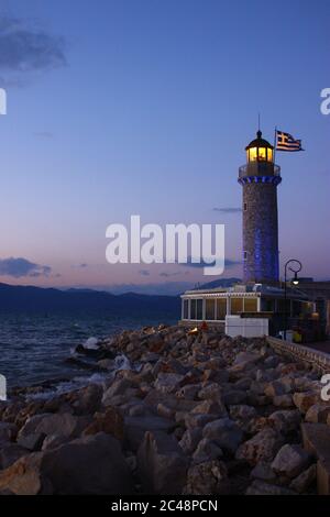 The lighthouse of Patras, with a Greek flag Stock Photo - Alamy