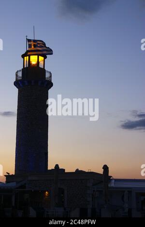 The lighthouse of Patras, with a Greek flag Stock Photo - Alamy