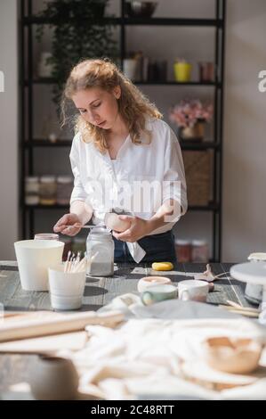 girl works with potter wheel Stock Photo - Alamy