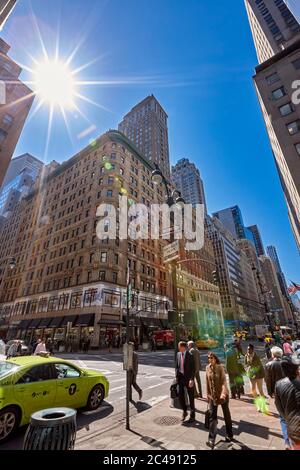 People walk on Fifth Avenue in Manhattan, New York City. (Photo by ...