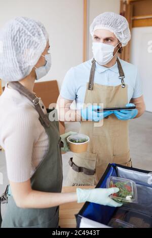 food delivery man in protective mask Stock Photo - Alamy