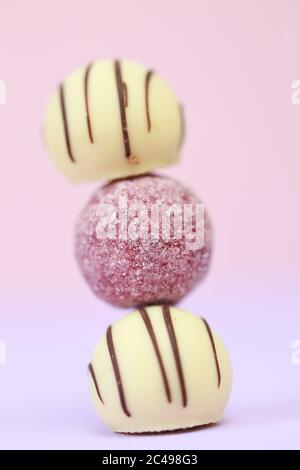 Row of assorted chocolate truffles Stock Photo - Alamy