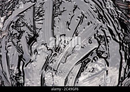 Surface of liquid tar for abstract backgrounds Stock Photo - Alamy
