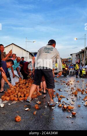 coconut smashing during thaipusam festival, photo is taken at Penang ...