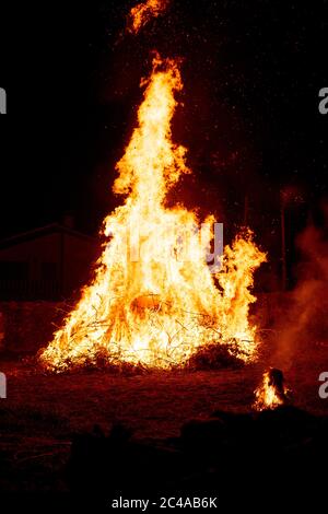 Giant bonfire burning in the night Stock Photo - Alamy