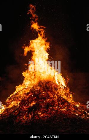 Top of a giant bonfire burning in the night Stock Photo - Alamy
