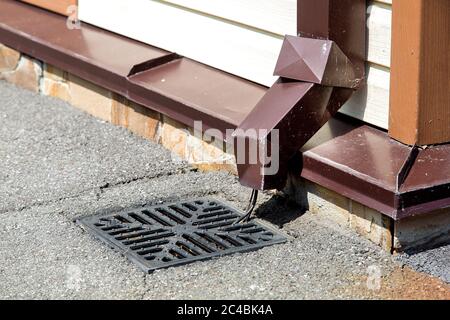 stormwater pipe on facade with rainwater drainage into drainage system ...