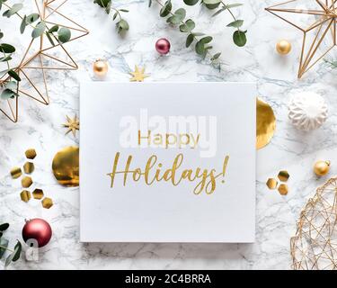 White winter twigs with shiny geometric leaves and scattered glass Xmas ...