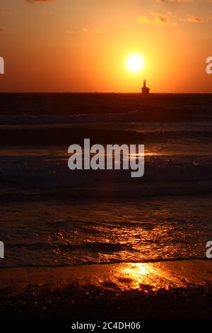 Sunrise at the lighthouse of Tourlitis at Andros, Greece Stock Photo ...