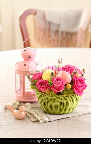 Florist at work: woman shows how to make Easter table decoration with ...