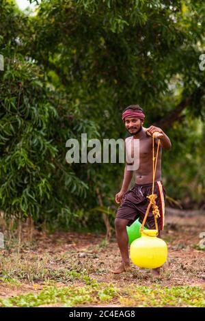 SOUTH GOA, INDIA - May 05, 2020: Barges carrying mining ore for export ...