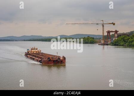 SOUTH GOA, INDIA - May 05, 2020: Barges carrying mining ore for export ...