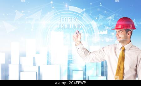 Handsome businessman with helmet drawing FOREX TRADING inscription ...