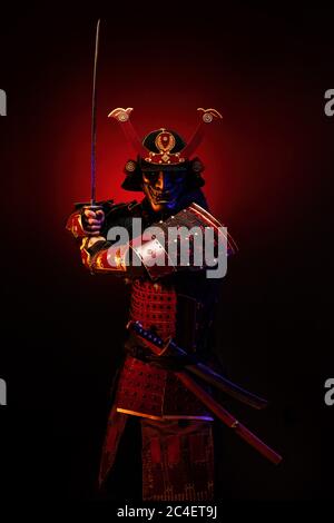 Portrait of a samurai in armor in attack position Stock Photo - Alamy