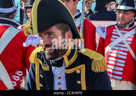 British Army Officer wearing a red tunic and medals at a cerimonial ...