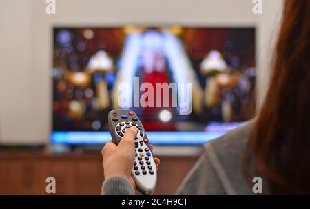 Women watching tv shows and use remote controller Stock Photo - Alamy