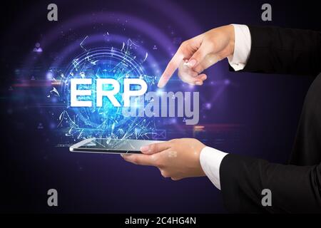 Close-up of a touchscreen with ERP abbreviation, modern technology ...