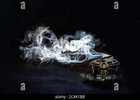 decorated incense with burning carbon and resins Stock Photo - Alamy