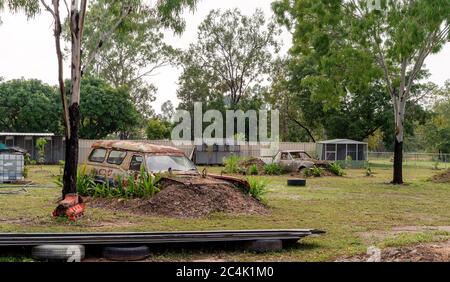 Old, rusty cars in the backyard of Delgadillo's Snow Cap Drive Inn on Route 66, Seligman ...