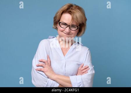 Mature woman puffing out cheeks, close-up, side view Stock Photo - Alamy