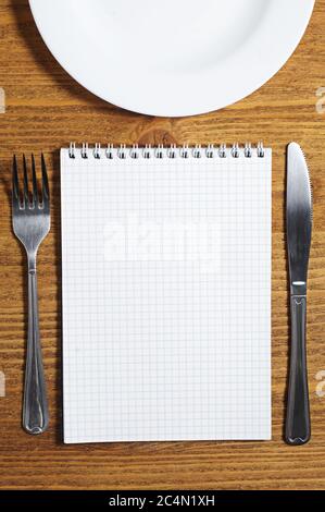 Notepad and cutlery. You can use as a template for a menu of cafes and ...
