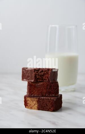 Closeup shot of chocolate biscuits near a glass of milk Stock Photo - Alamy