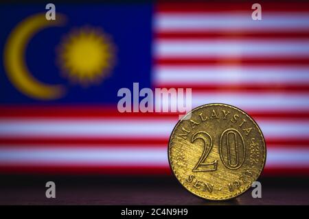 Golden Malaysian ringgit (MYR) coins in the hand Stock Photo - Alamy