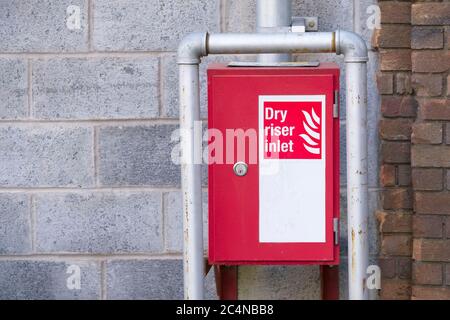 Dry riser red inlet box and sign at wall Stock Photo - Alamy