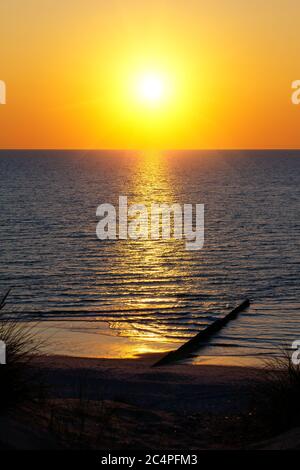 Sunrise scenery with the beautiful Sylt island beach and the horizon ...