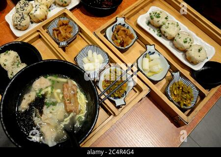 Typical Chinese food on tablechi in Guangzhou, China. Chinese dumplings ...