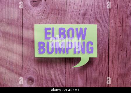 Conceptual hand writing showing Elbow Bumping. Concept meaning ...