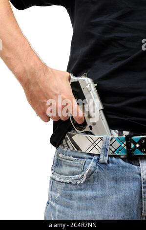 Man with gun tucked in pants isolated on white Stock Photo - Alamy