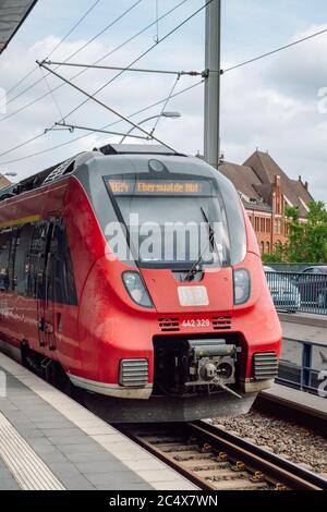 Regional passenger train (RB Regional Bahn) passing over a motorway ...