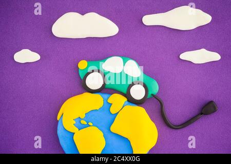 Electric car driving around the planet Earth. Concept Image. Scene is ...