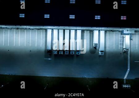 Night Loading dock at a warehouse. modern logistics center. docking ...