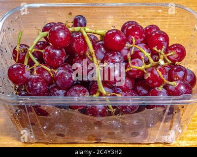 a plastic punnet of grapes Stock Photo - Alamy