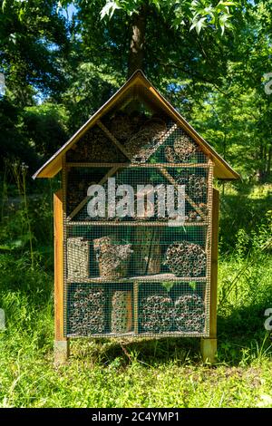 An insect hotel or insect house is an artificially created nesting and ...