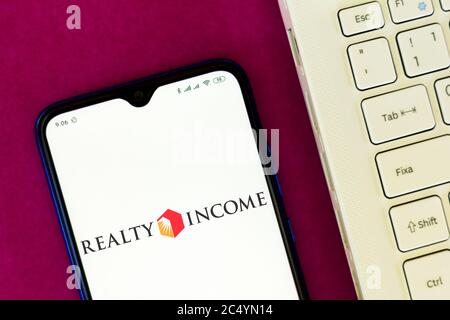 In this photo illustration Realty Income Corporation logo seen ...